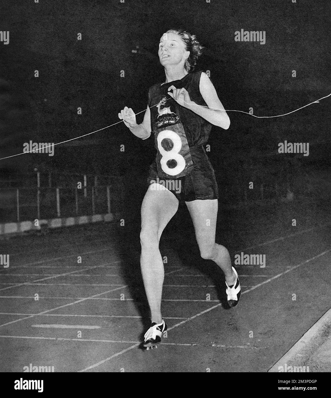 Diane Leather winning the mile race Stock Photo - Alamy