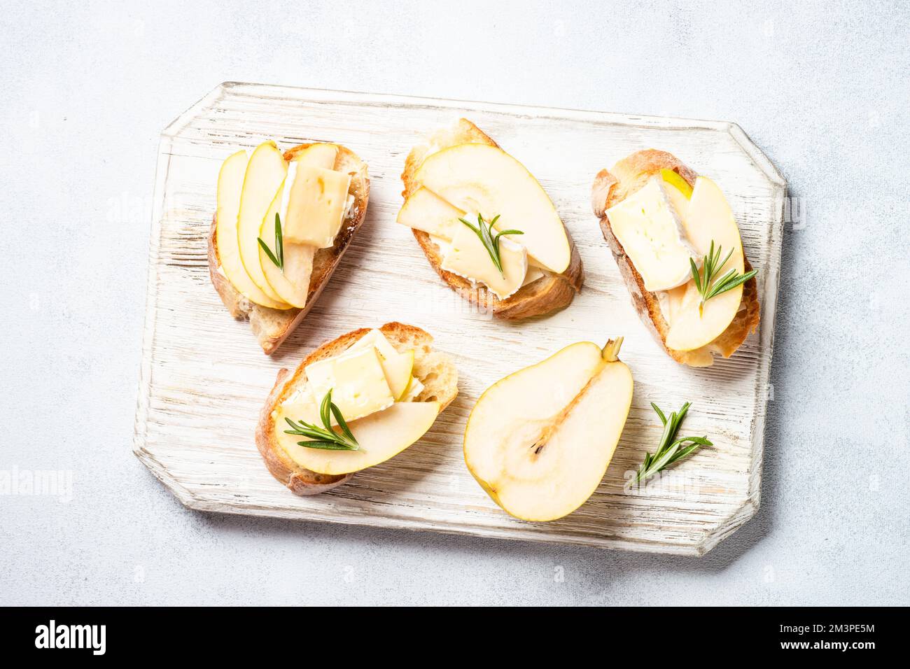 Sweet toast with pear, cheese and honey Stock Photo - Alamy