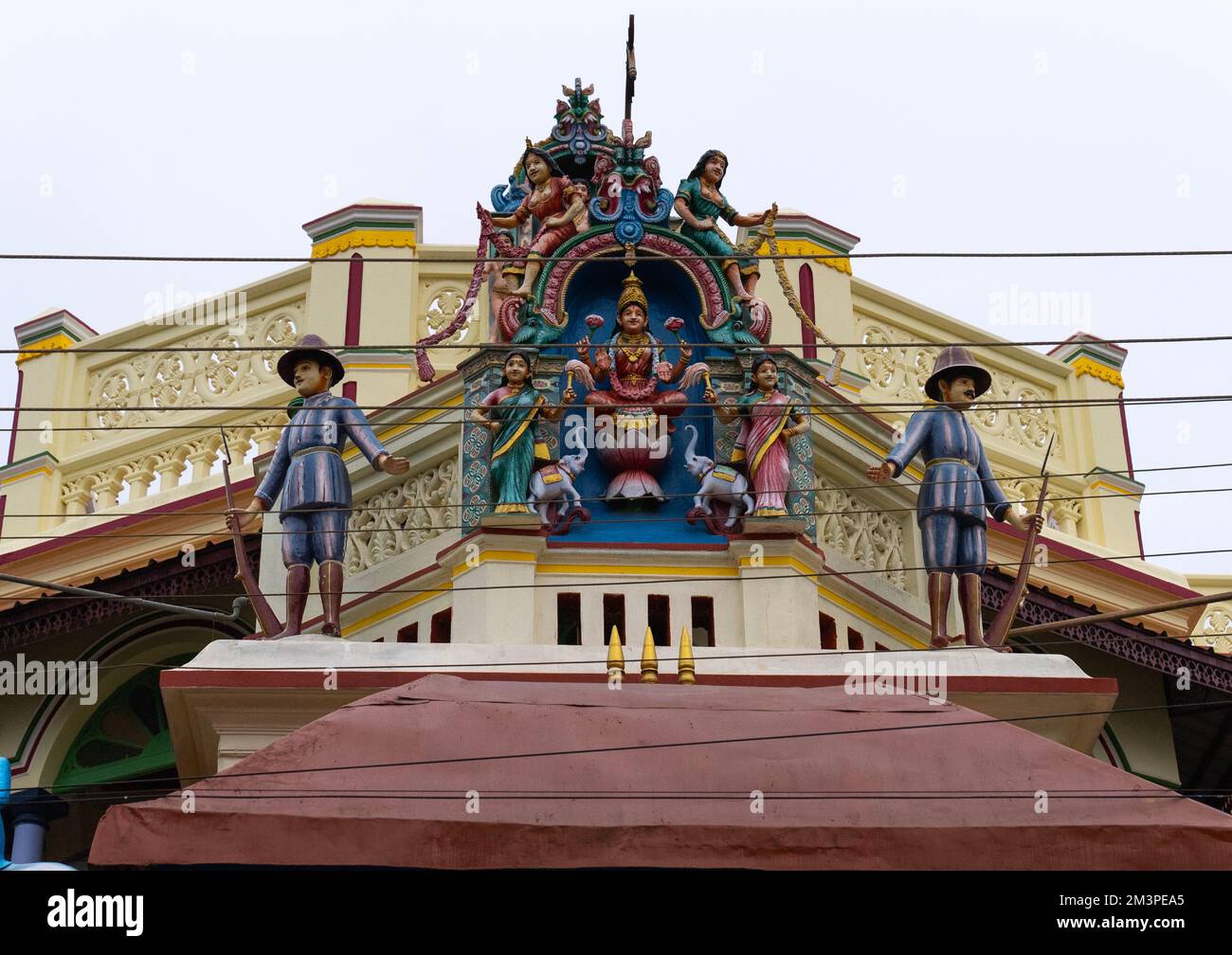Goddess Lakshmi flanked by elephants and British soldiers on a house ...