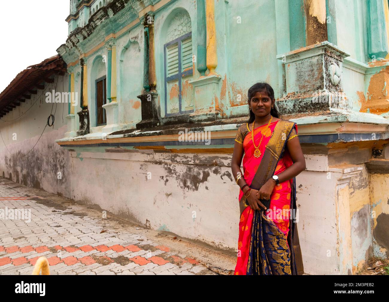 Indian woman in front of an old Chettiar mansion, Tamil Nadu ...