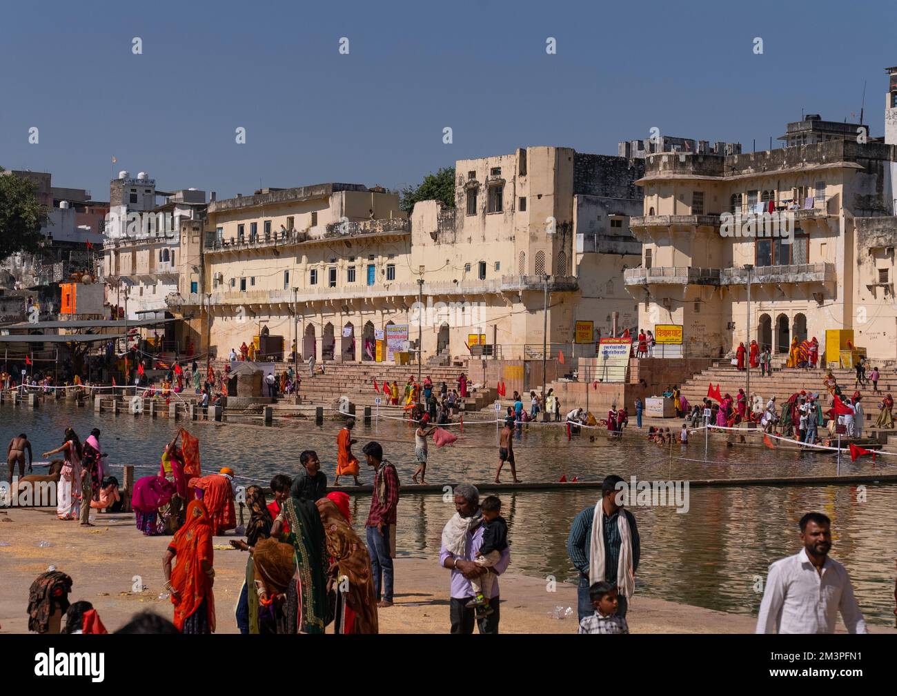 Indian pilgrims in Barhama lake and bathing ghats, Rajasthan, Pushkar ...