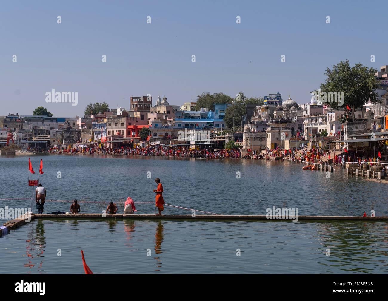 Indian pilgrims in Barhama lake and bathing ghats, Rajasthan, Pushkar ...