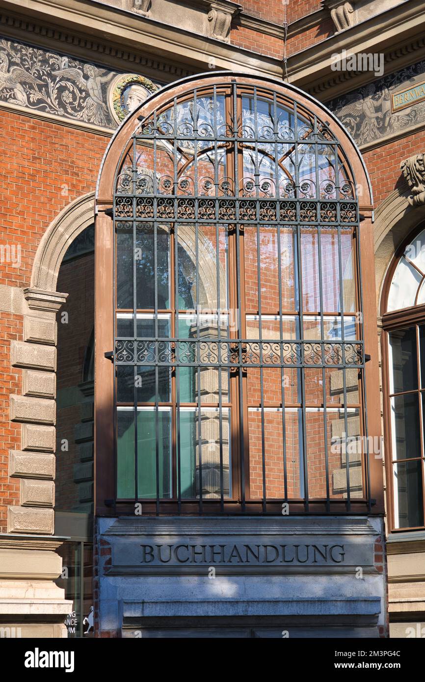 The vertical view of a vintage bookstore entrancetranslation: bookshop ...