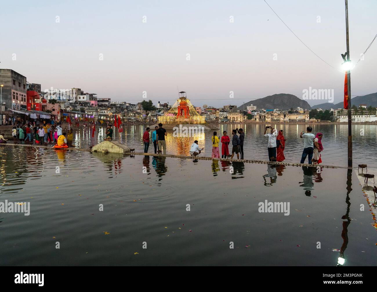 Indian pilgrims in Barhama lake and bathing ghats, Rajasthan, Pushkar ...