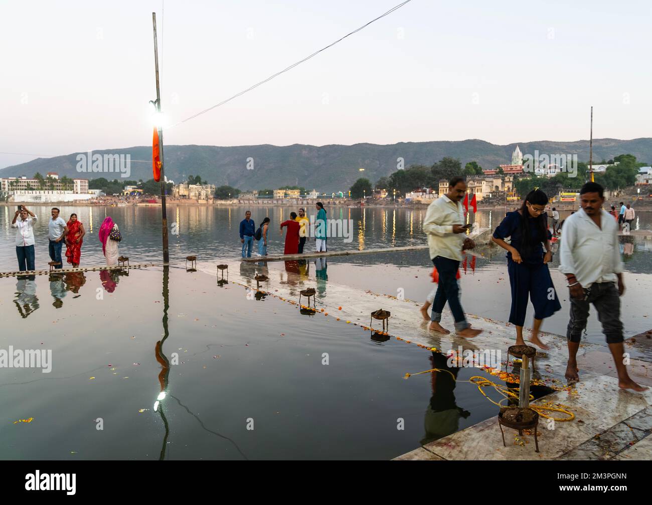 Indian pilgrims in Barhama lake and bathing ghats, Rajasthan, Pushkar ...