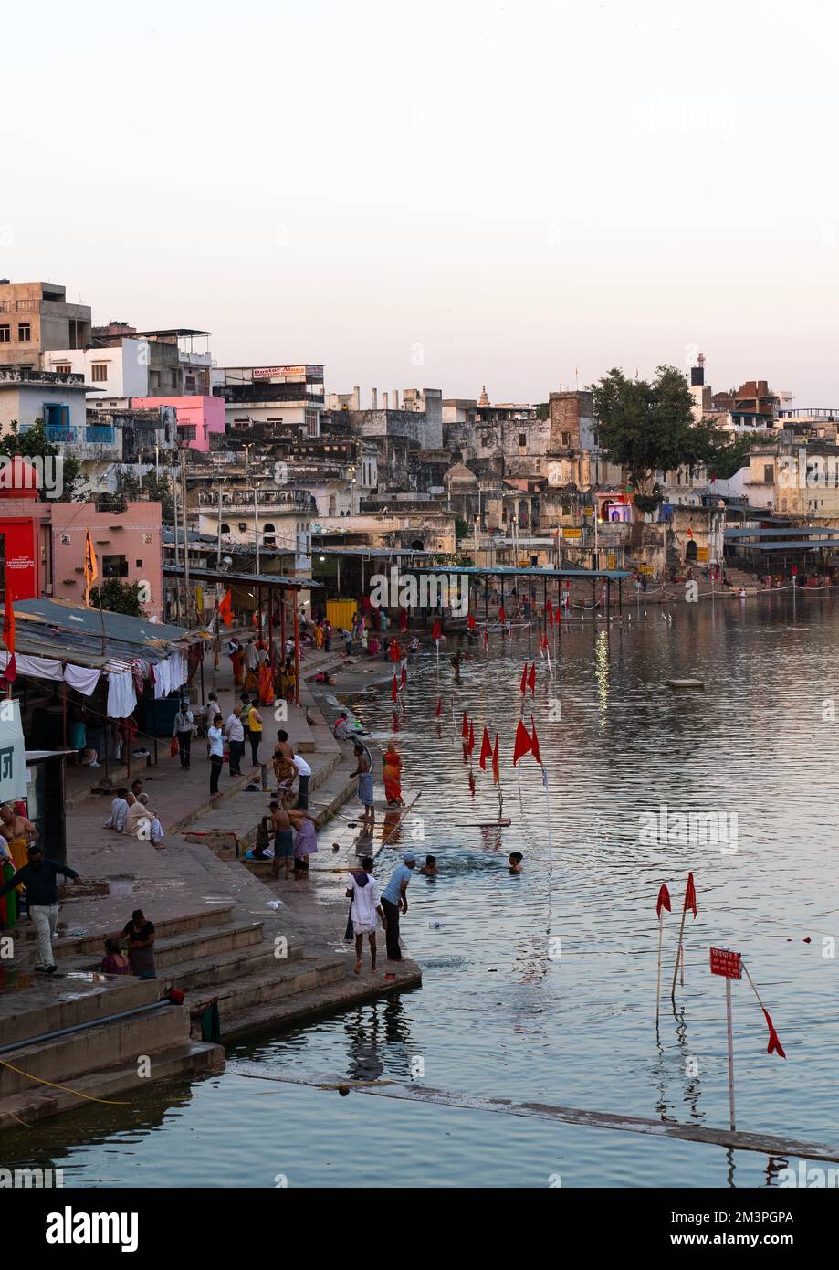 Indian pilgrims in Barhama lake and bathing ghats, Rajasthan, Pushkar ...