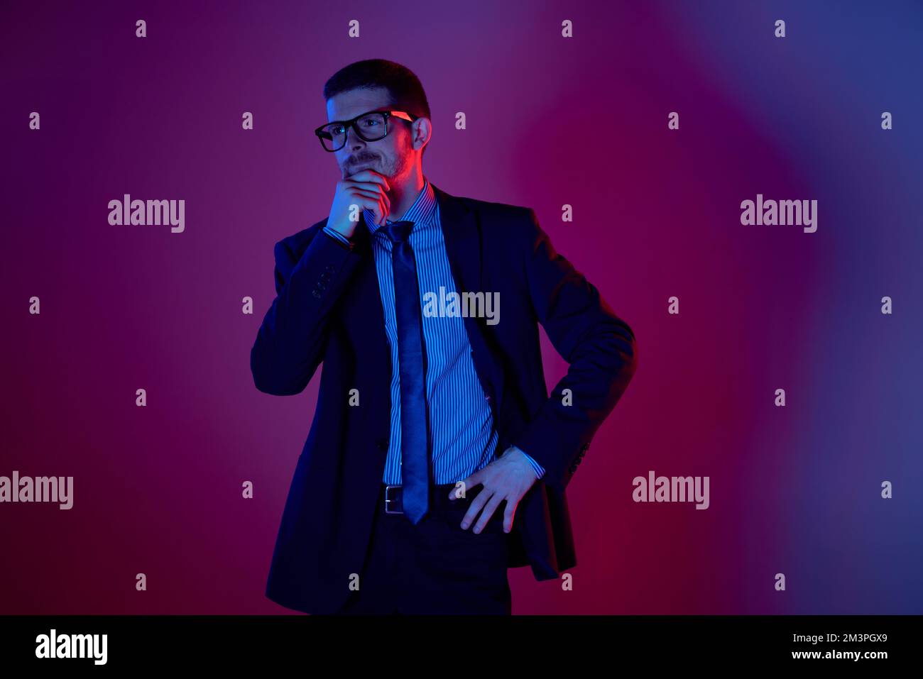 Portrait of young caucasian businessman in business suit and eyewear ...