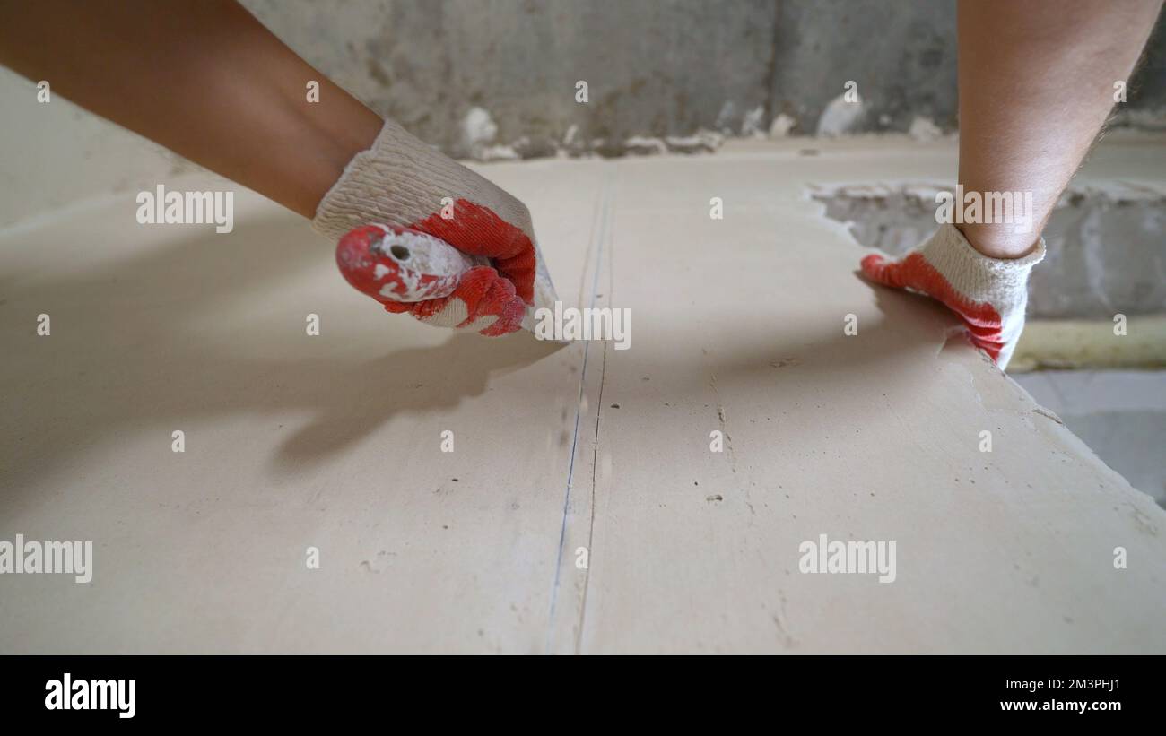 The master cuts the wall with a knife to extract the lighthouse. The ...