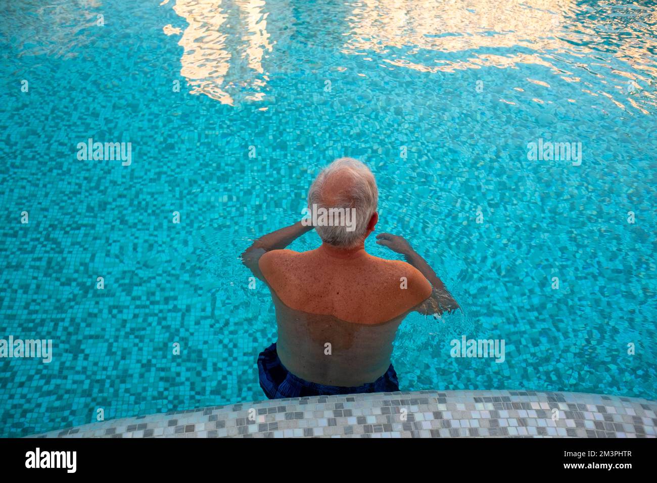 Bald man swimming in pool hi-res stock photography and images - Alamy