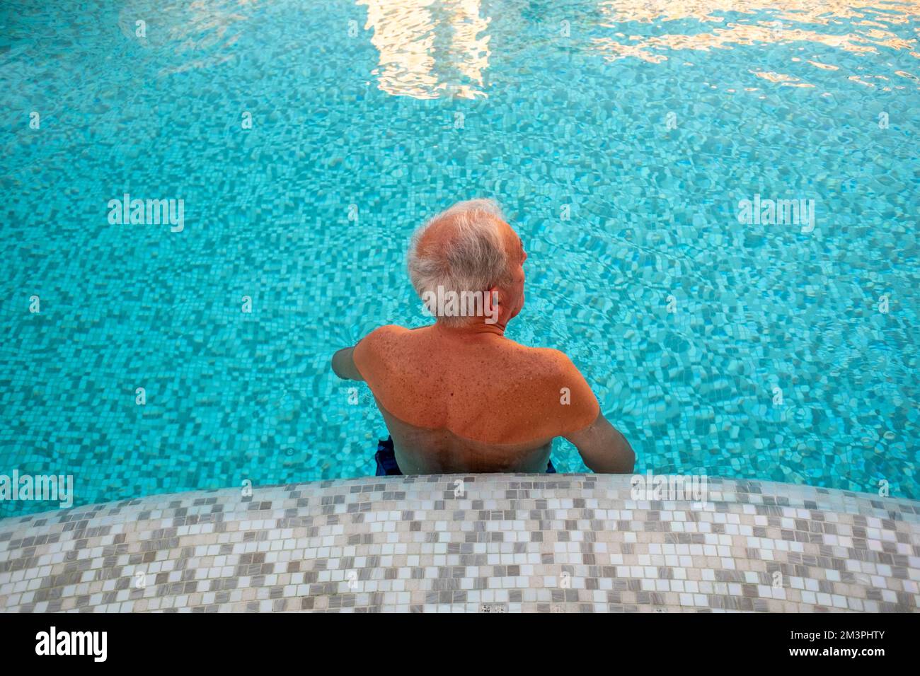 Bald man swimming in pool hi-res stock photography and images - Alamy