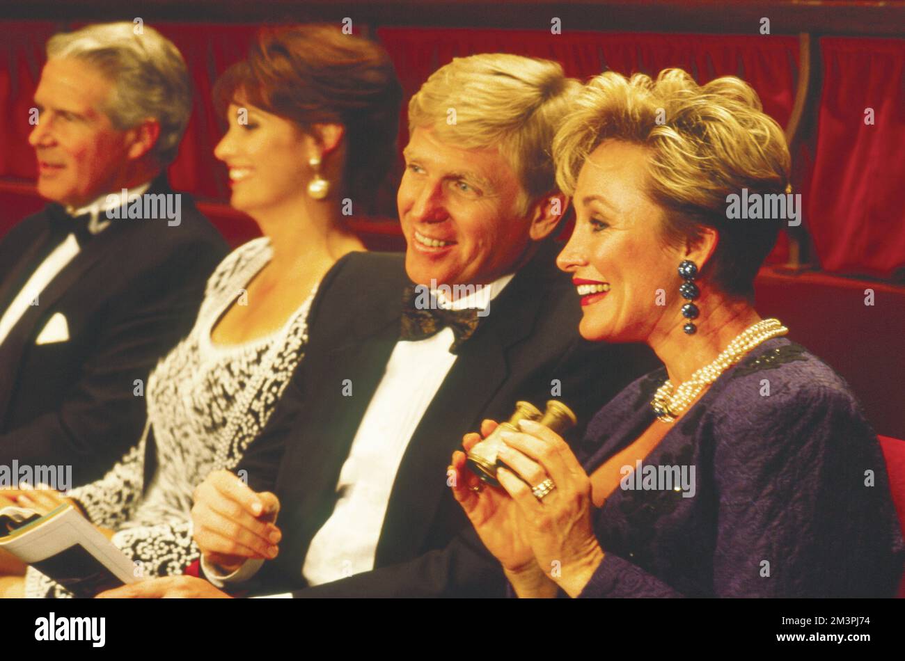 Two white/caucasian couples at the opera Stock Photo - Alamy