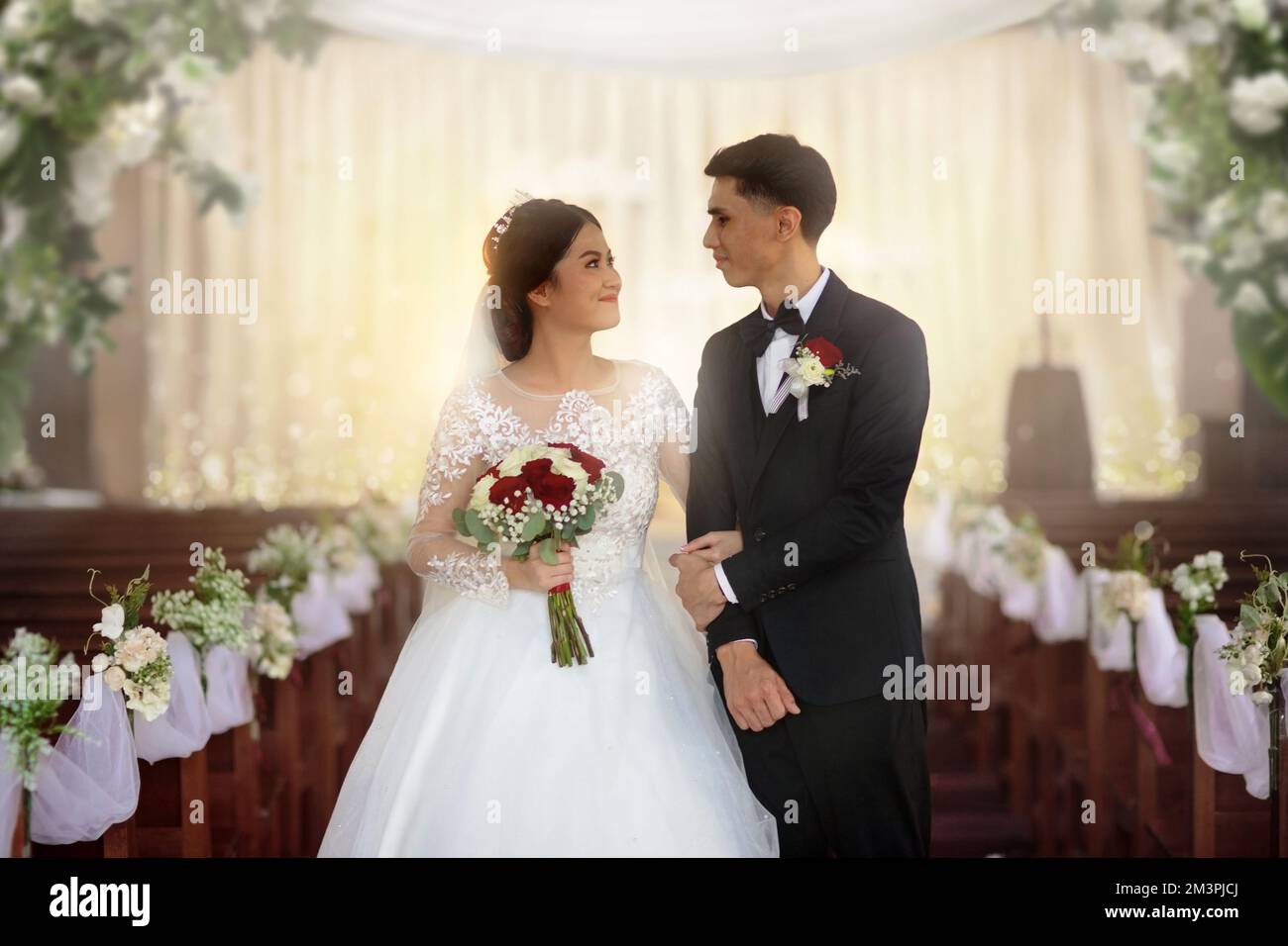 Bride and groom on wedding day. Beautiful young Asian couple. Newly wed ...