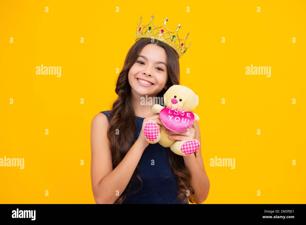 Birthday kids prom party. Teen child in queen crown isolated on yellow ...