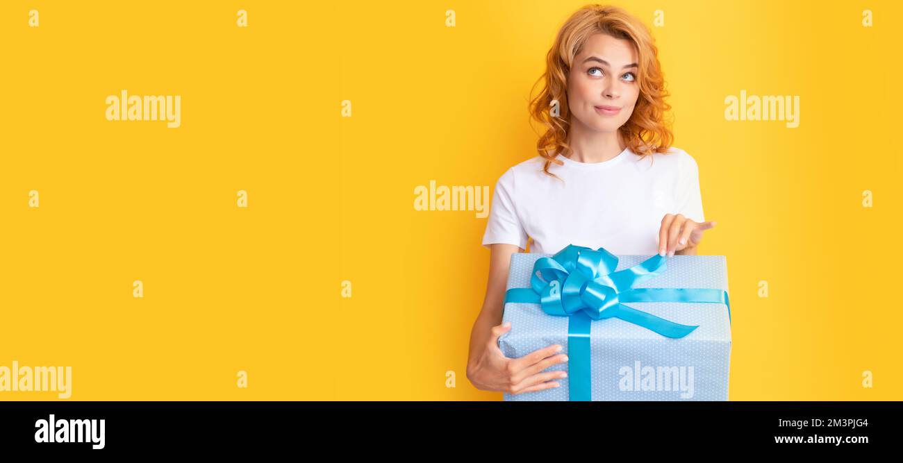 cheerful dreamy redhead lady opening giftbox. womens day. Beauty woman ...