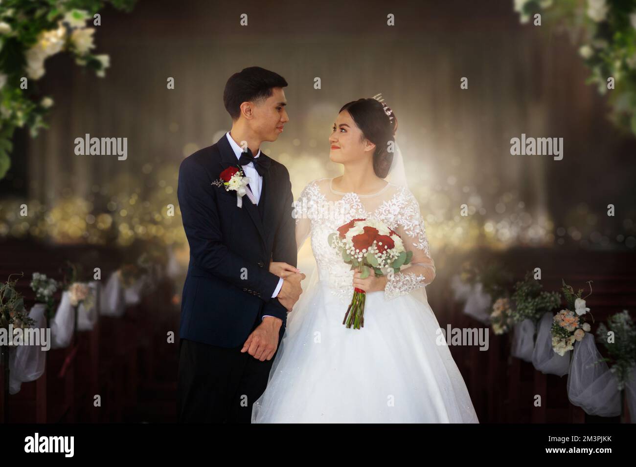 Bride and groom on wedding day. Beautiful young Asian couple. Newly wed ...