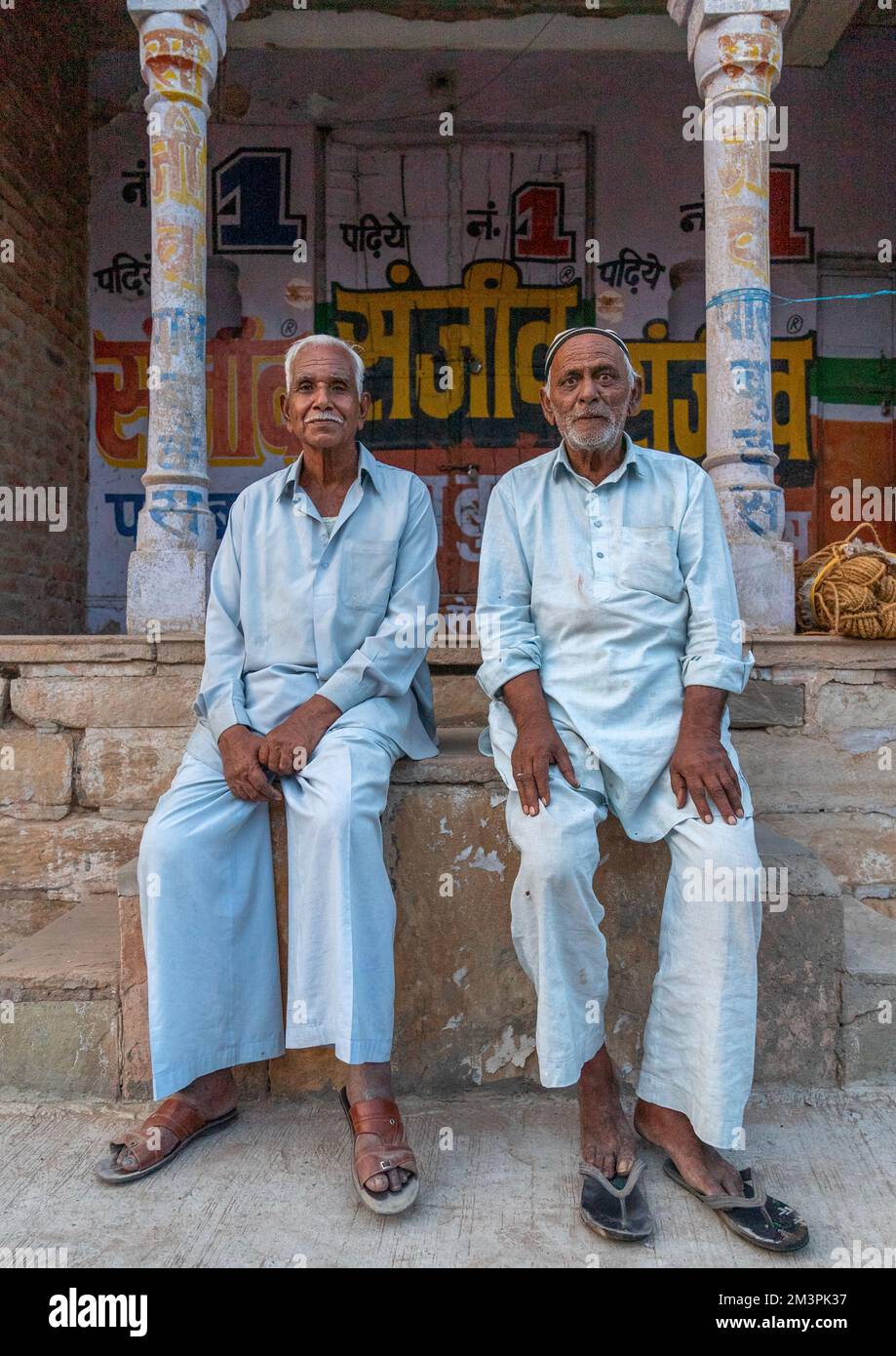 Indian senior men sit in the street, Rajasthan, Mukundgarh, India Stock ...