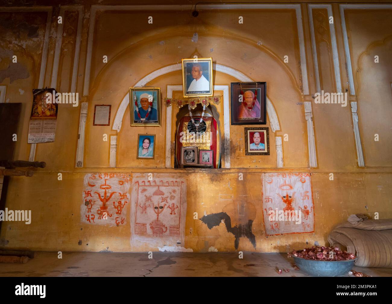 Family pictures hanging on the wall of the fort, Rajasthan, BIssau ...