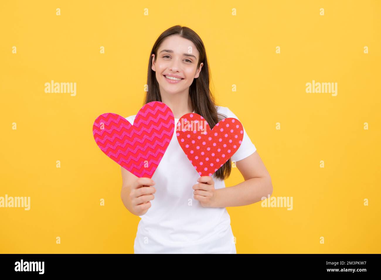 Young woman valentines day concept, girl with heart shaped card. Lovely ...