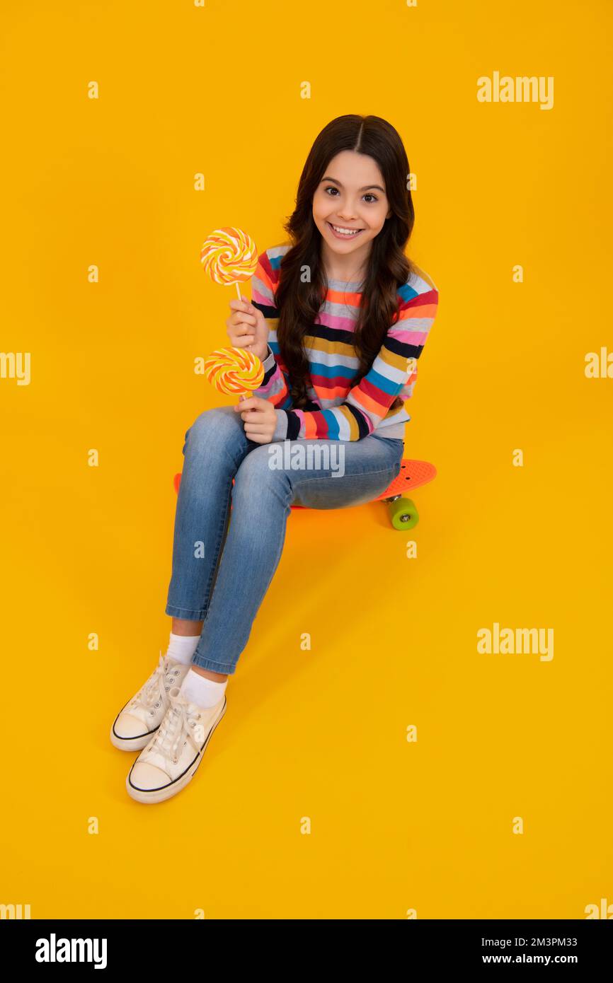 Teenage girl with candy lollipop, happy child 12, 13, 14 years old ...