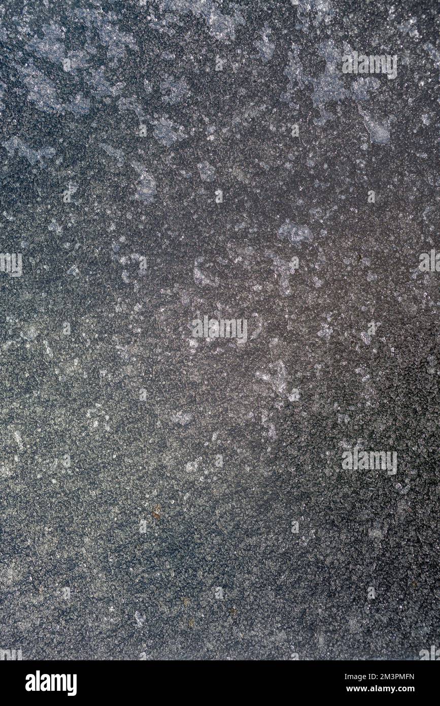 Winter frost background on a frozen window panel showing wintertime ice ...