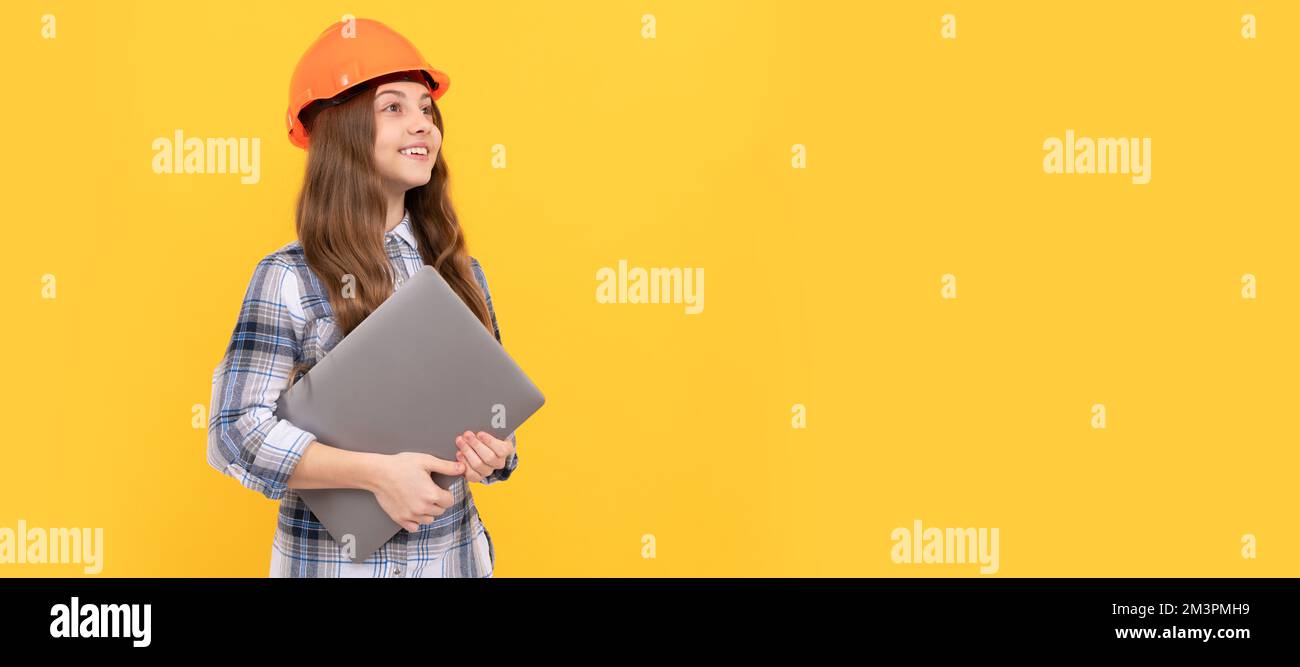 builder kid hold computer. building and construction. webinar. happy child worker. Child in hard ...