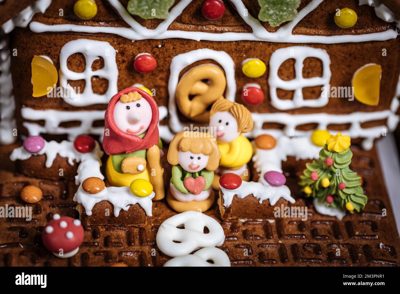 Christmas house made from gingerbread. Playfully decorated with ...