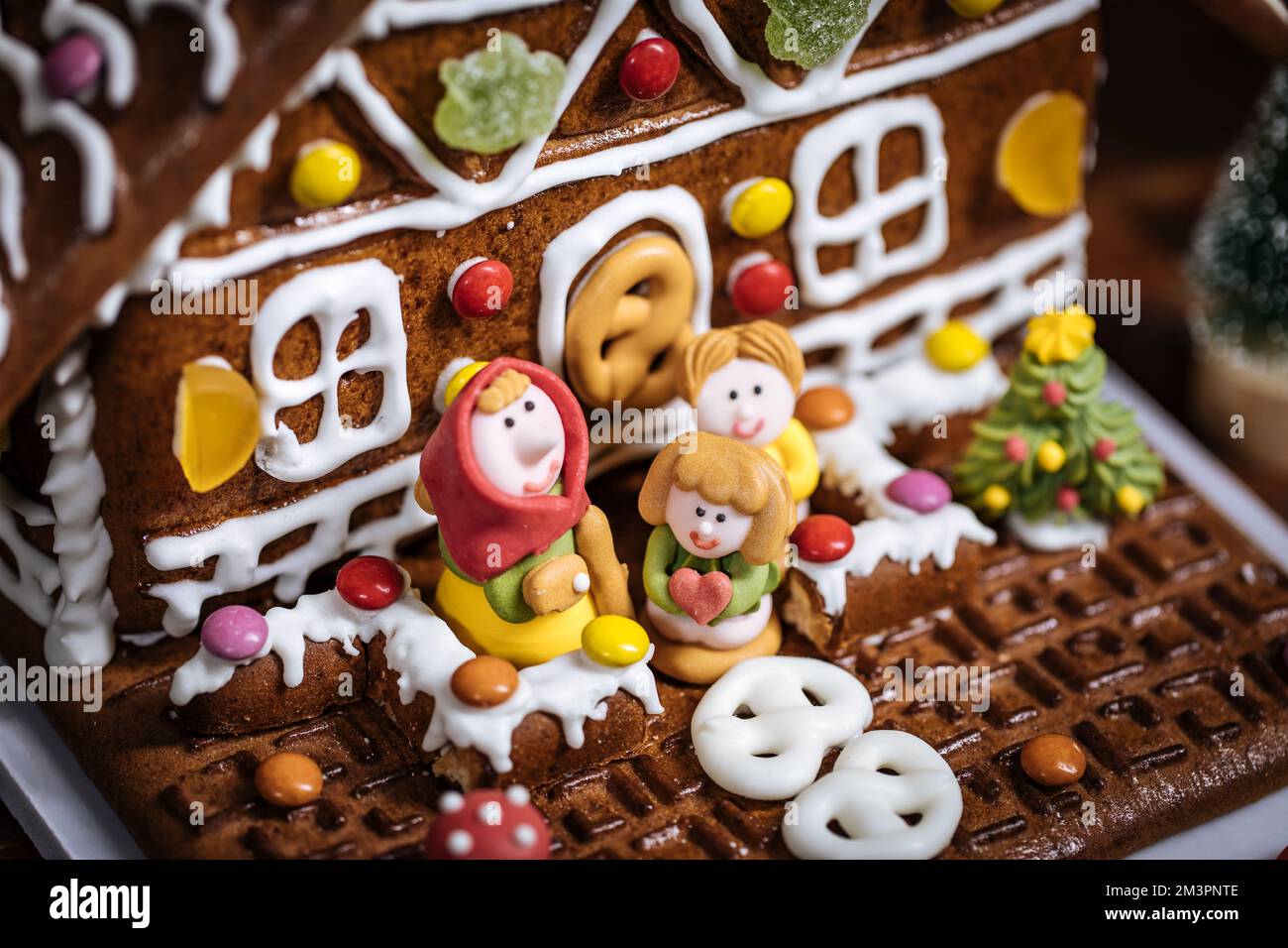Christmas house made from gingerbread. Playfully decorated with ...