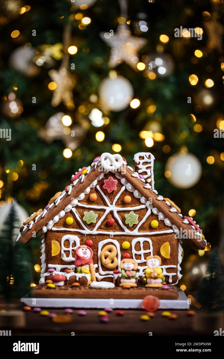 Christmas house made from gingerbread. Playfully decorated with ...