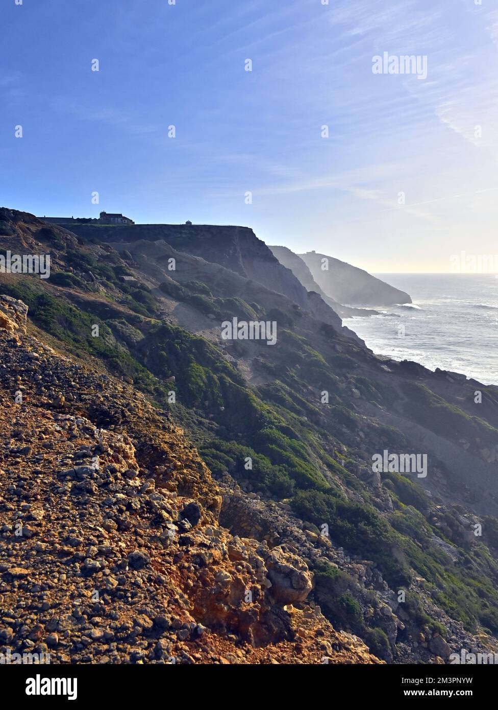 Dramatic cliffs at Cape Espichel on coast of Atlantic Ocean. The location is famous for the ...