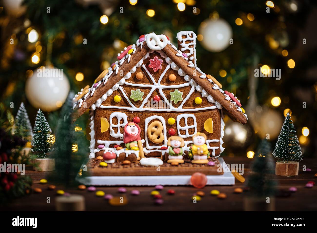 Christmas house made from gingerbread. Playfully decorated with ...