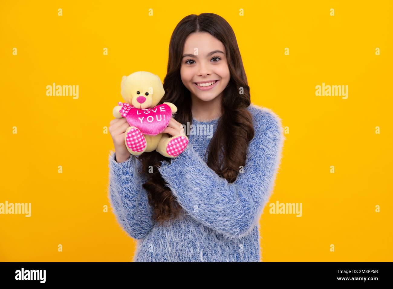 Childhood, toys and kids. Cute teen girl cuddling fluffy toy. Child ...