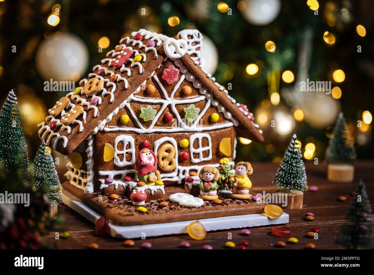 Christmas house made from gingerbread. Playfully decorated with ...
