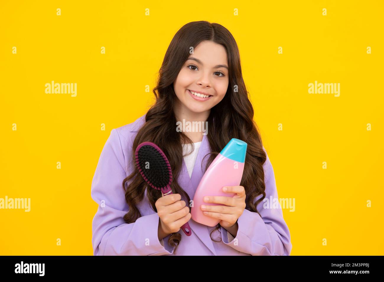 Teenage girl with shampoos conditioners or shower gel. Kids hair care ...