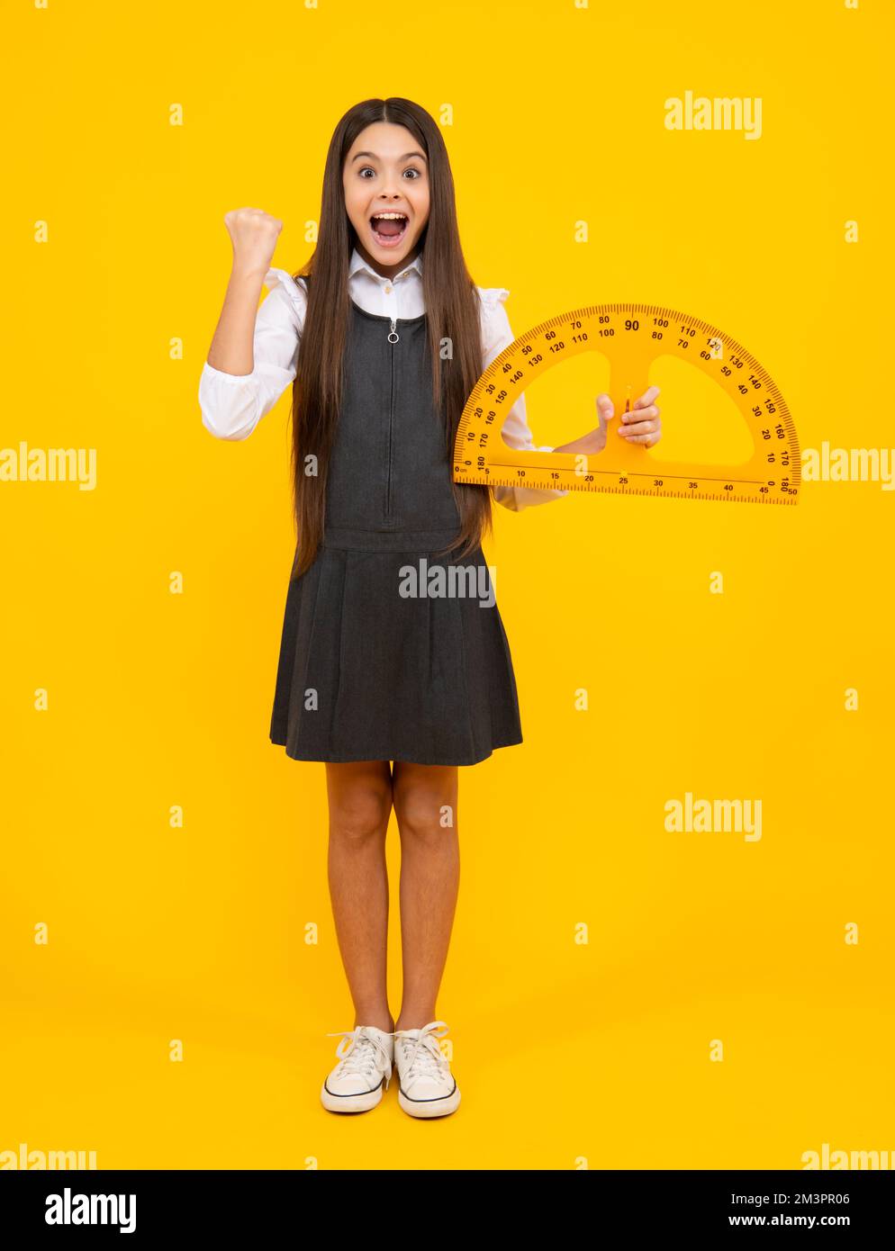 Teenager child school girl holding measure for geometry lesson ...