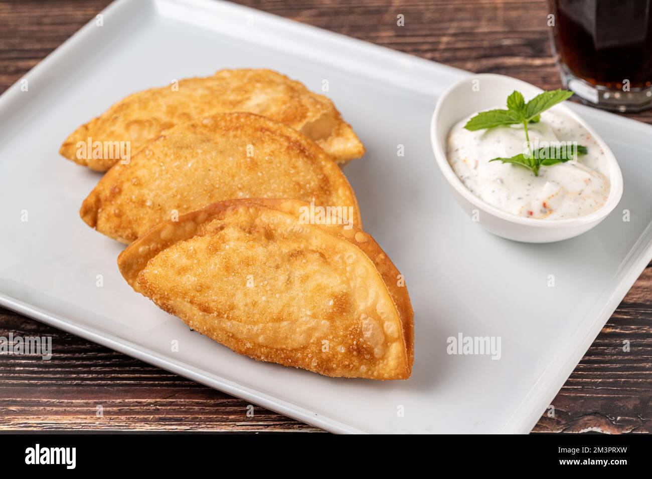 Beef Cheburek on a wooden table. Deep Fried Beef Dumplings with meat ...