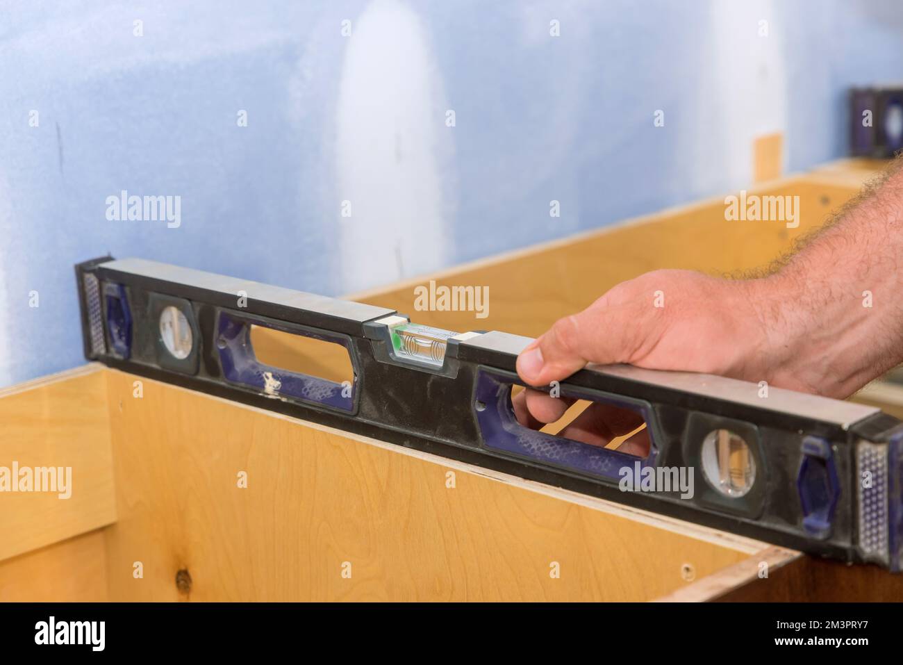 Level is used when installing kitchen cabinets in order to ensure that ...