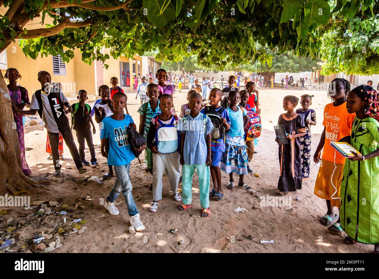 MBOUR, SENEGAL - DECEMBER Circa, 2020. Group of unidentified teenagers ...