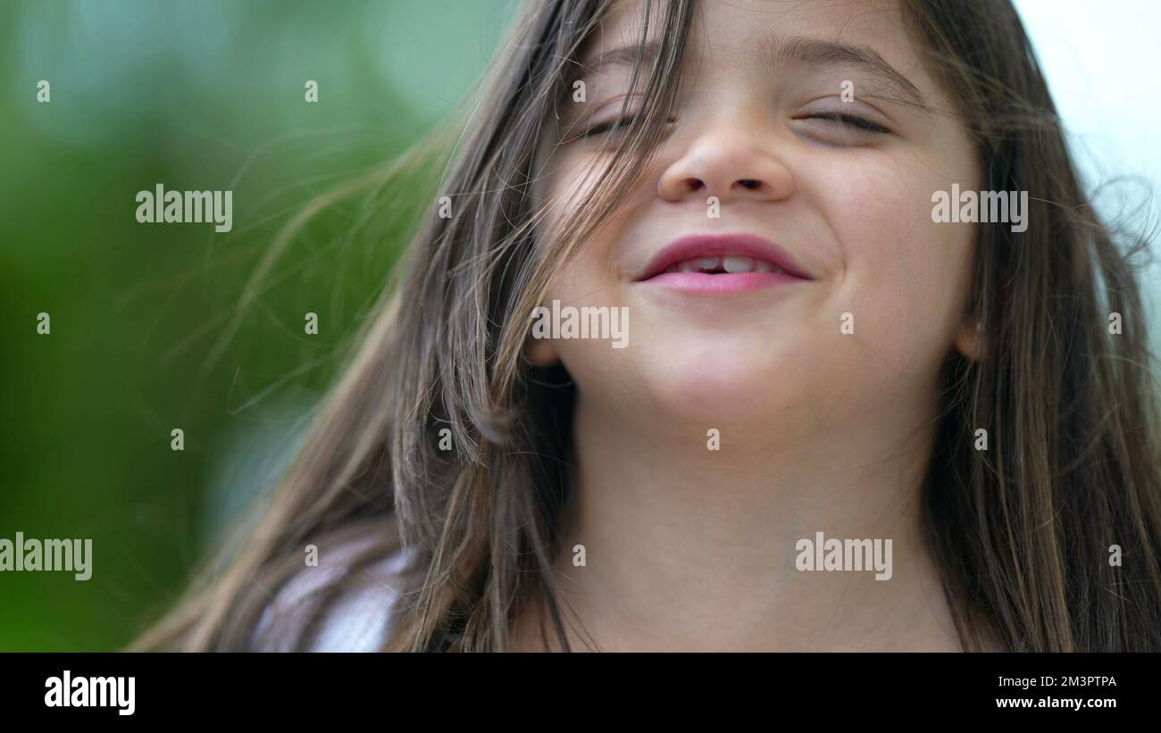 Adorable small girl portrait face with milk teeth missing smiling child ...
