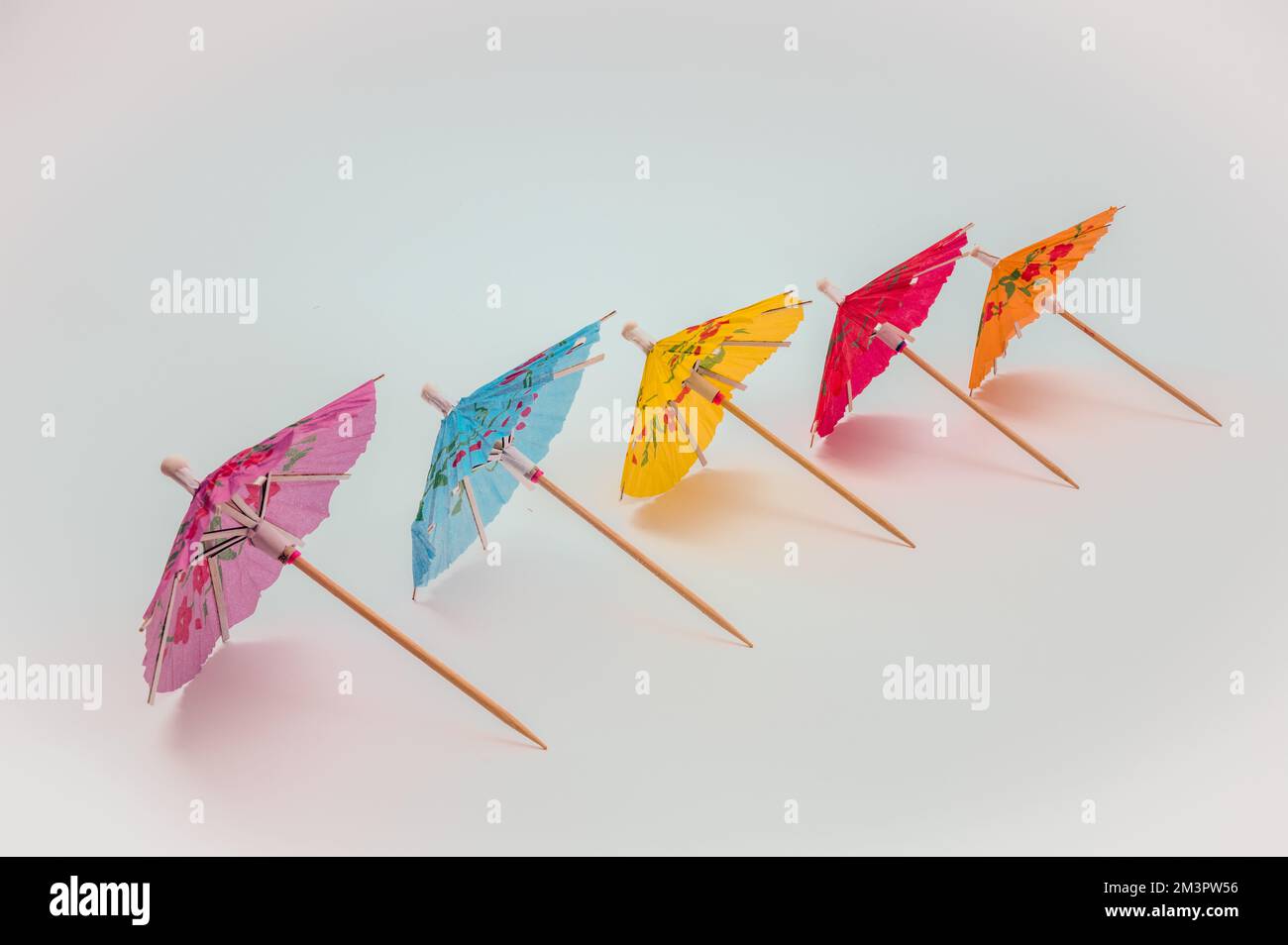 side view of colorful party drinks parasol umberellas open Stock Photo ...