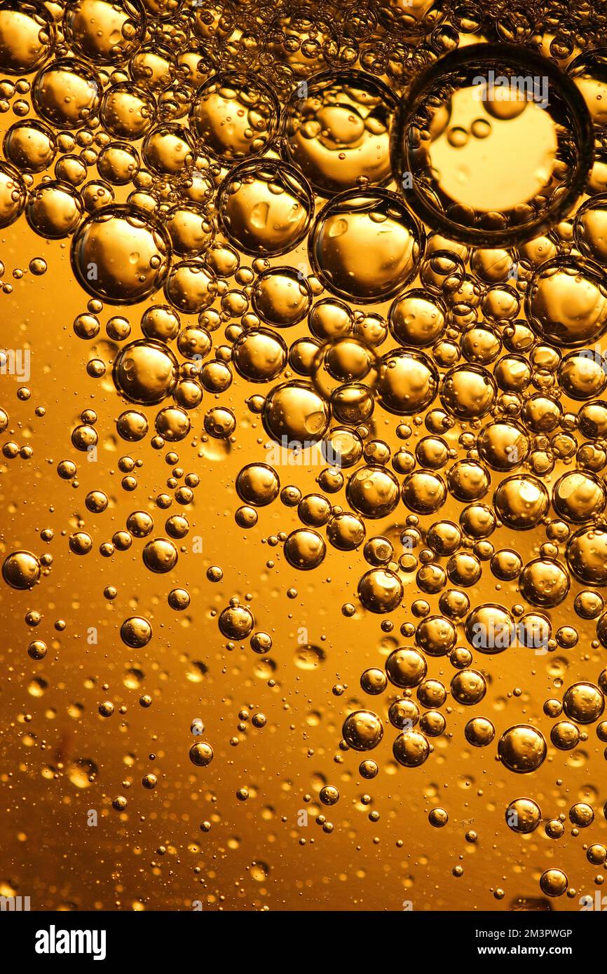 golden oil blisters on yellow background Stock Photo - Alamy