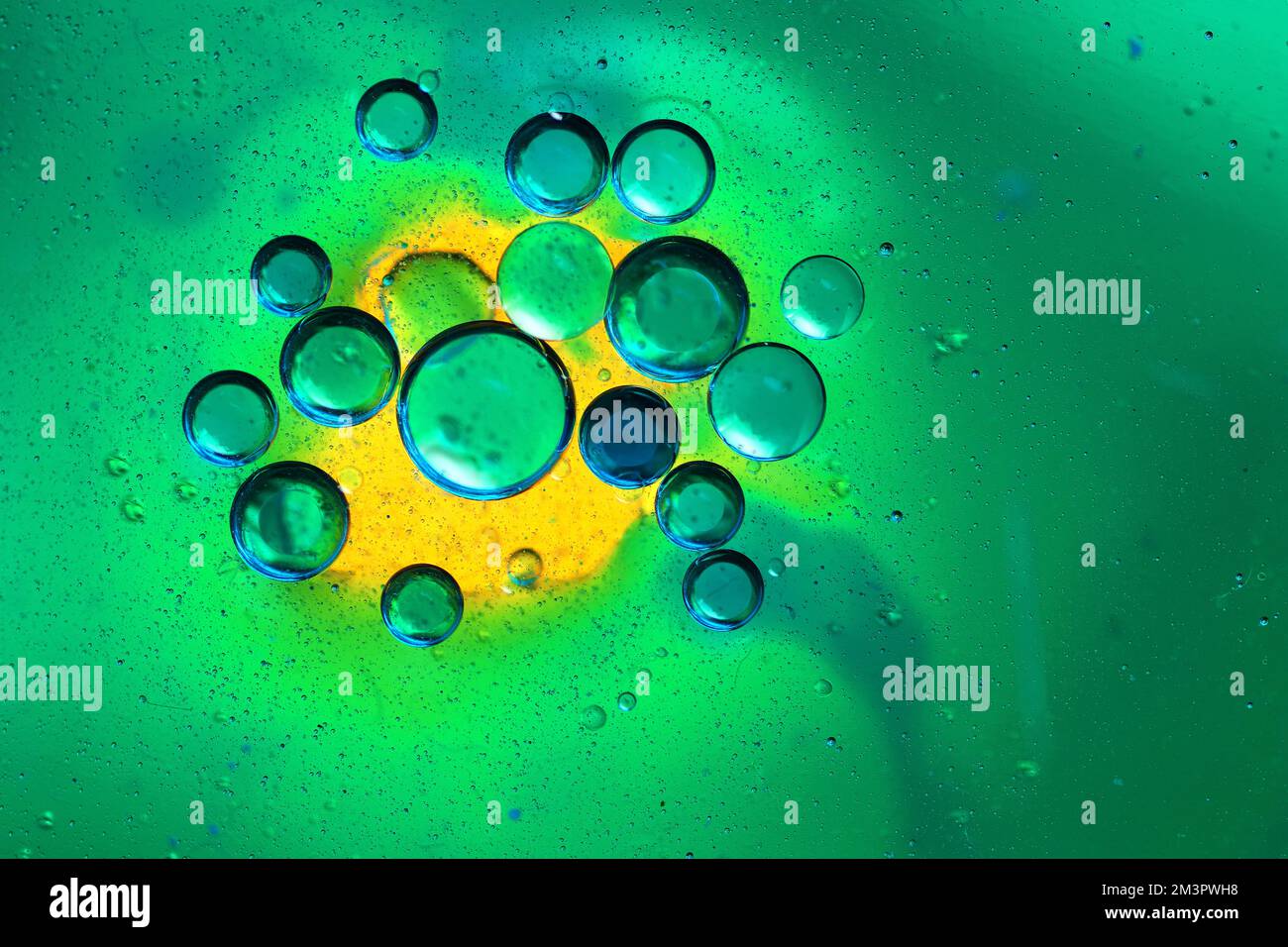 colorful oil bubbles over yellow background Stock Photo - Alamy