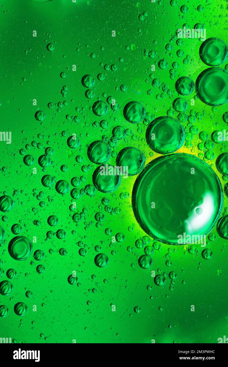 colorful oil bubbles over yellow background Stock Photo - Alamy