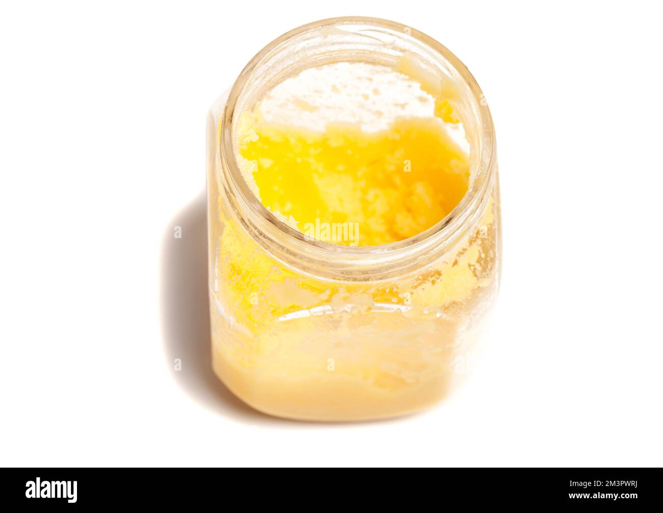 Ghee in jar isolated on white background Stock Photo - Alamy