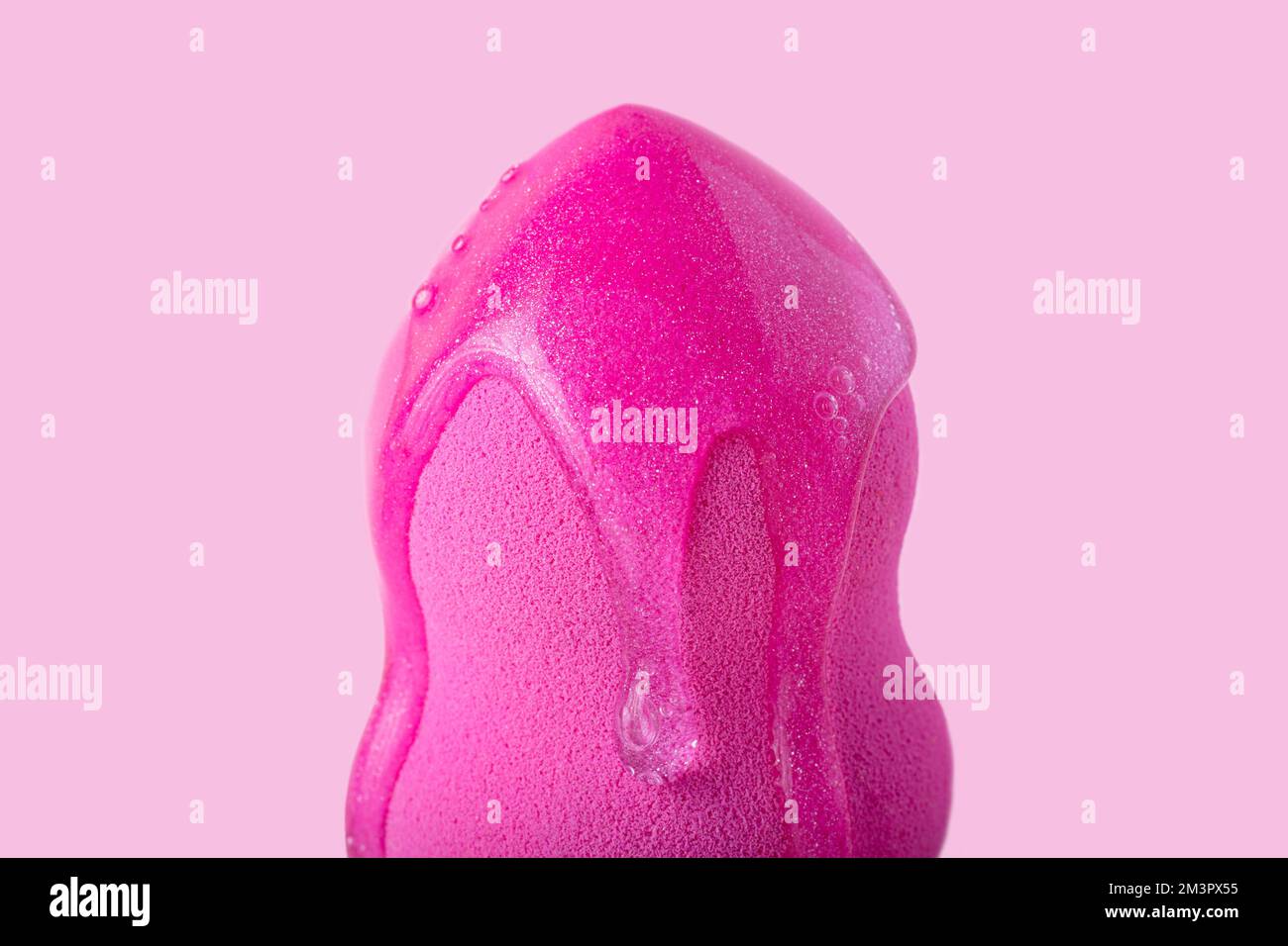 Closeup photography of beauty blender with dripping cosmetic gel on it ...