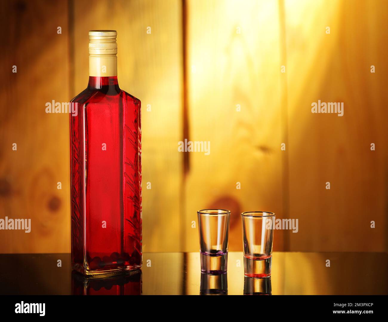 unlabeled vodka bottle with two glasses on a background of wooden ...