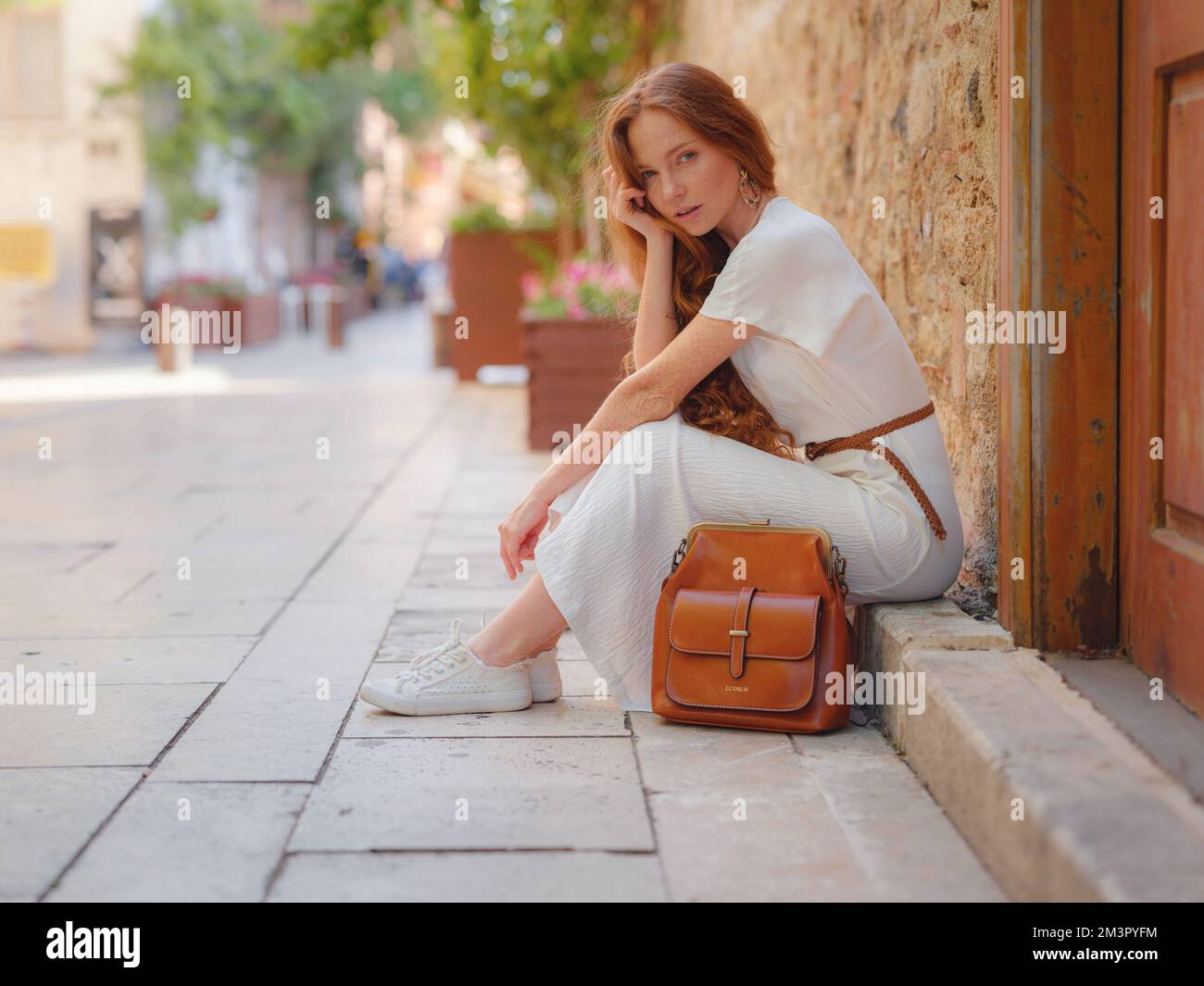 Happy woman tourist on background of blooming street of Antalya. female ...