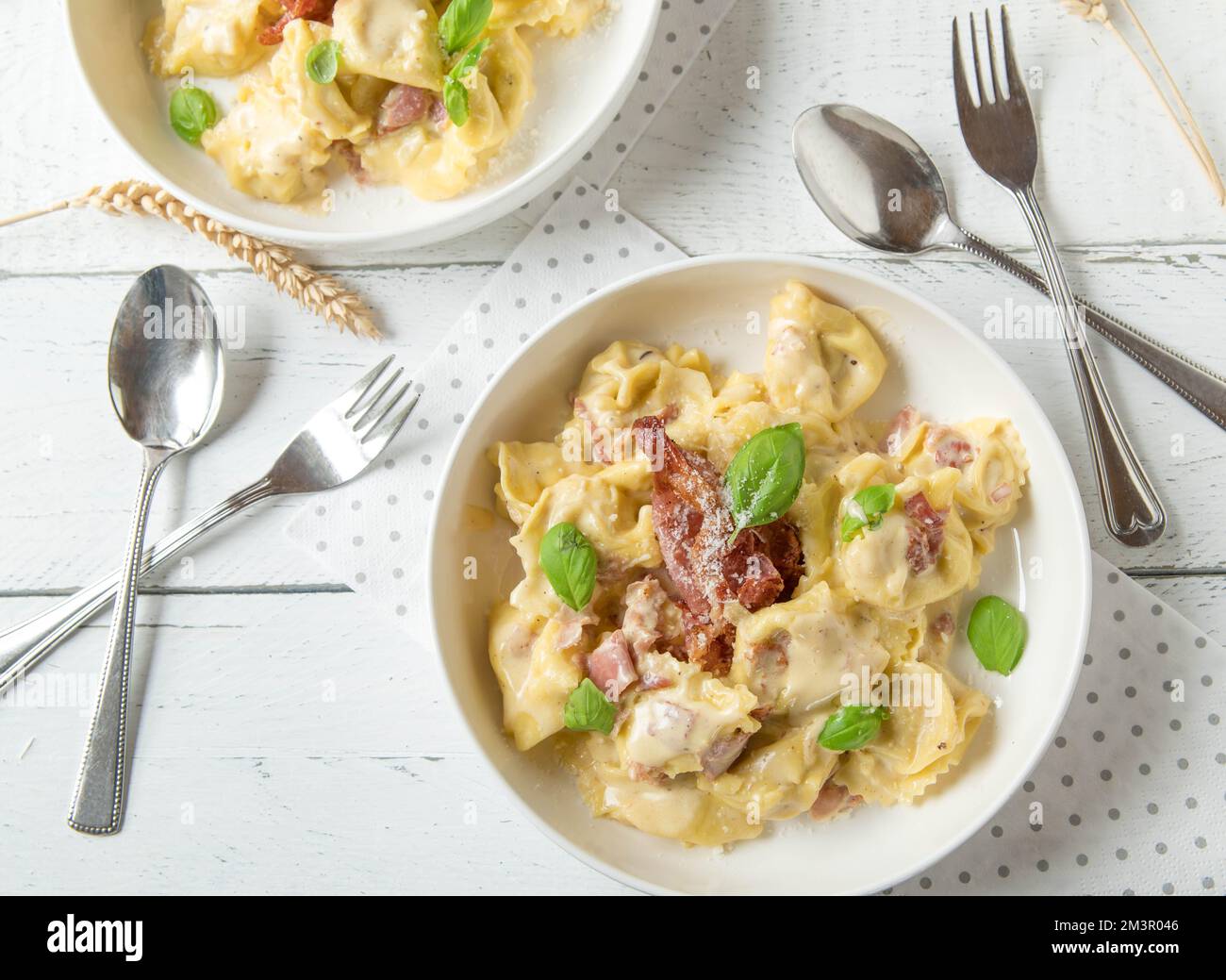 Tortellini alla panna traditional homemade cooked. Served on white ...