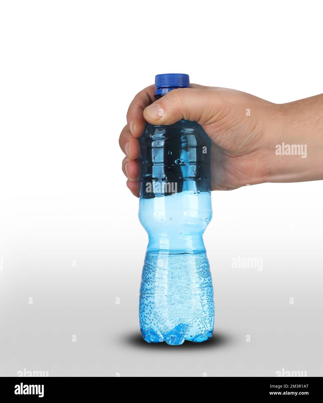 plastic bottle with water held in hand on a white background Stock ...