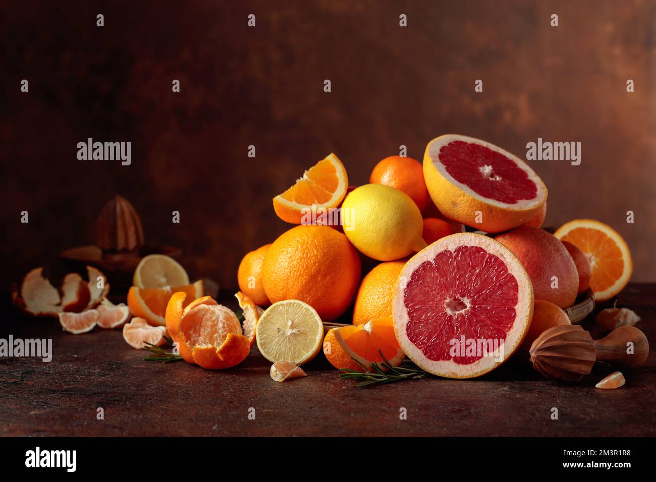 Citrus fruits on a old brown table. Presented are oranges, grapefruits ...