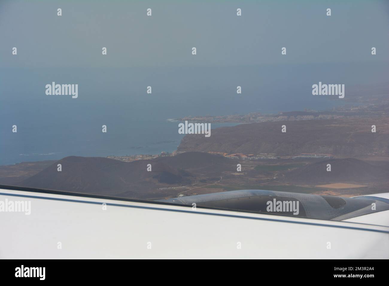 View from a murky airplane window on approach to Tenerife South Airport ...